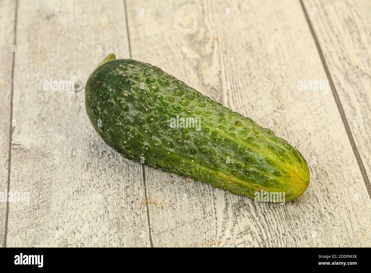Green ripe fresh one cucumber over background Stock Photo - Alamy