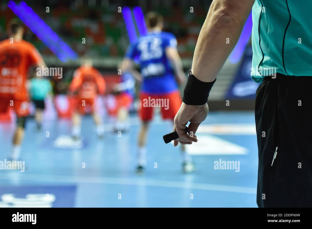 Handball referee hand with whistle Stock Photo - Alamy