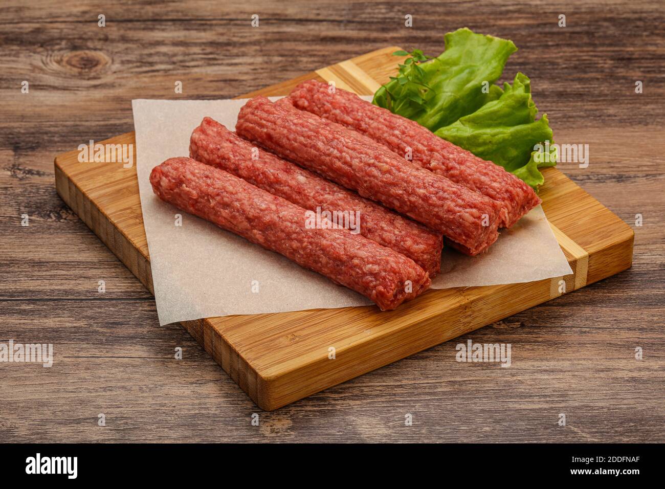 Raw beef sausages with spices for grill Stock Photo - Alamy
