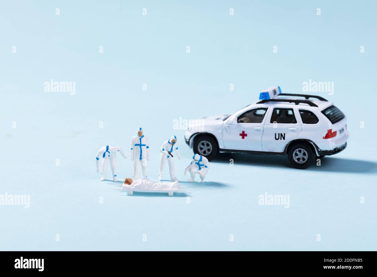 A closeup of toy ambulance and paramedics helping a patient Stock Photo ...