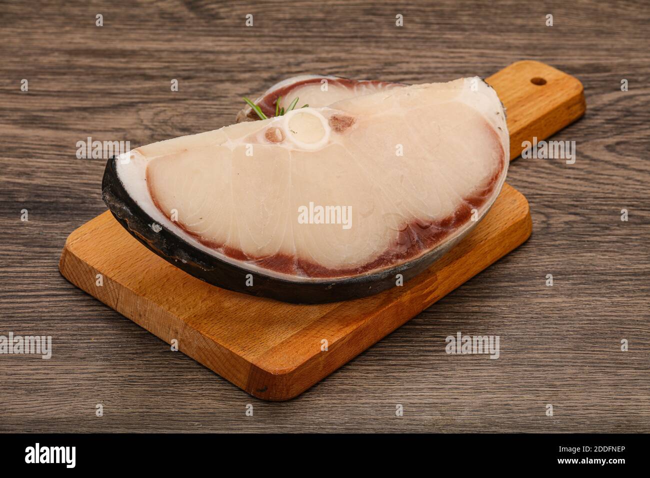 Raw shark steak served rosemary for cooking Stock Photo - Alamy
