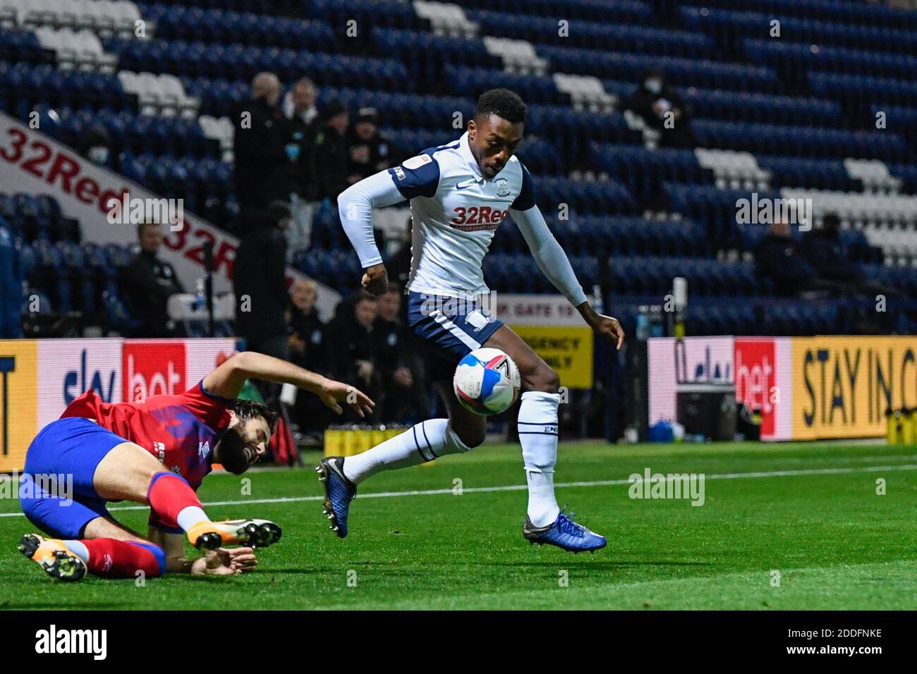 Darnell Fisher #2 of Preston North End runs past Ben Brereton #20 of ...
