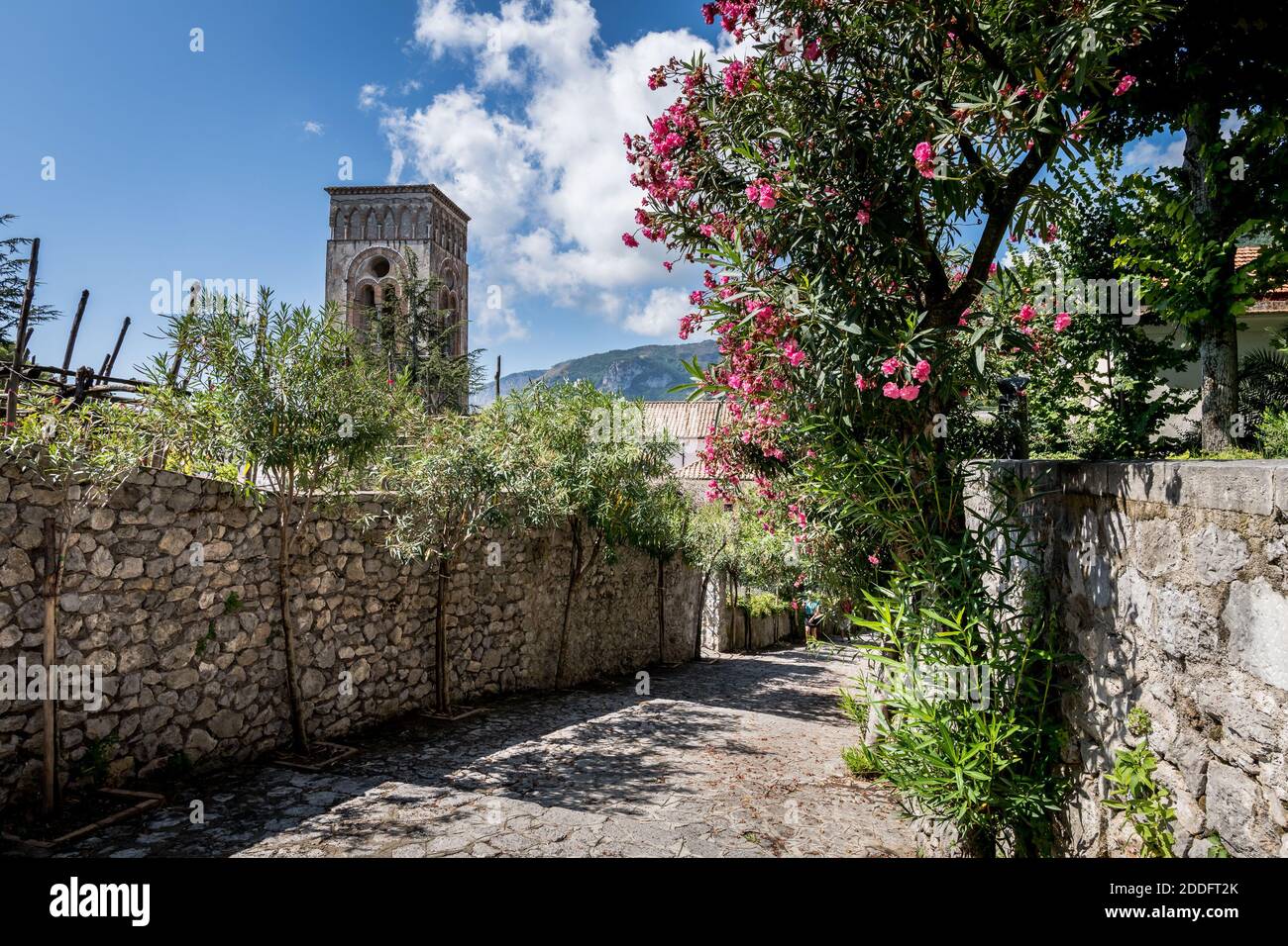 A cobbled path with the Duomo di Ravello Cathedral in the background ...