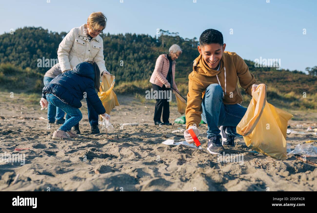 People Cleaning The Beach