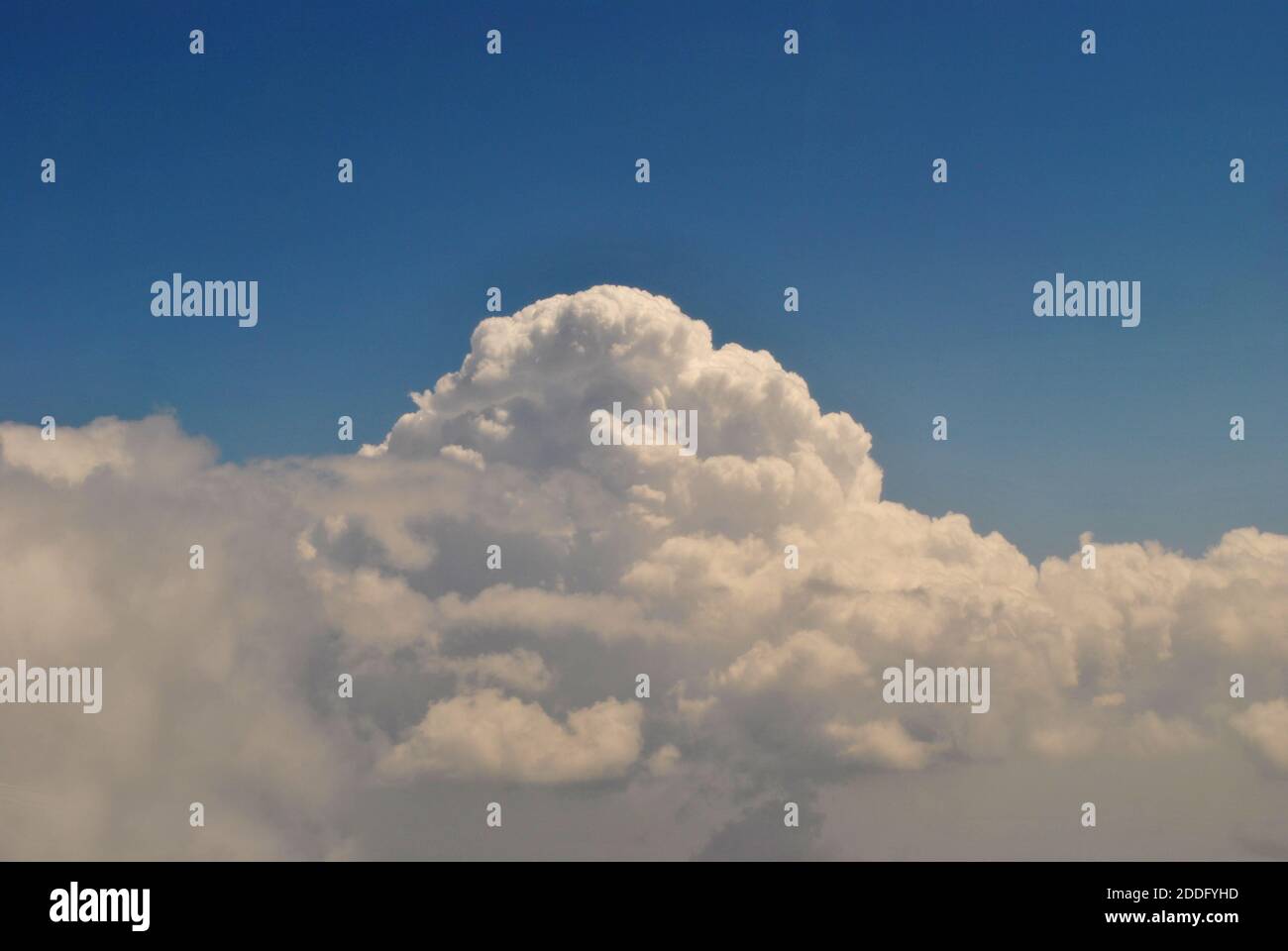 Saturated color of the blue sky with white clouds Stock Photo - Alamy