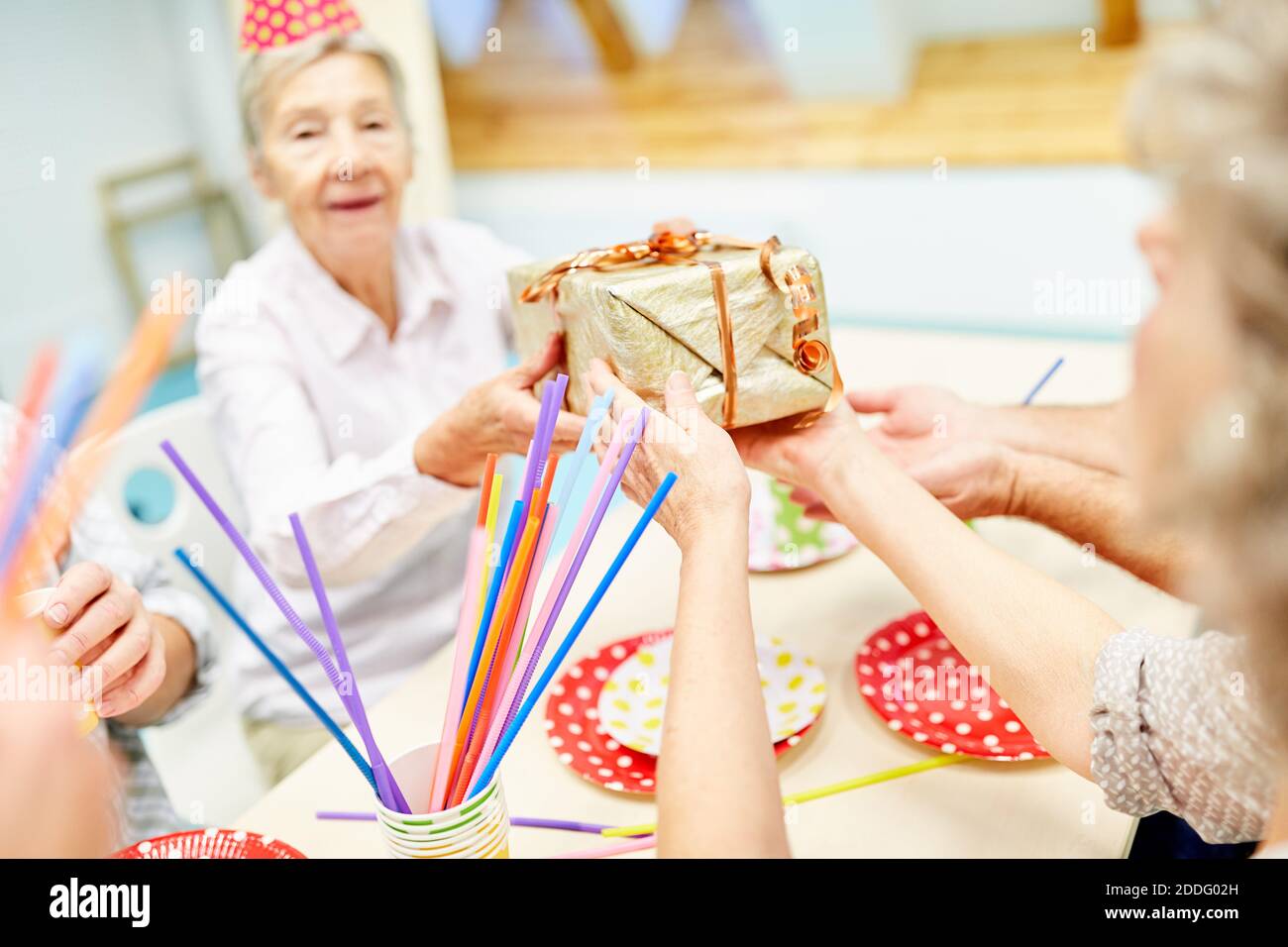 Old elderly woman celebrates her birthday in a nursing home and ...