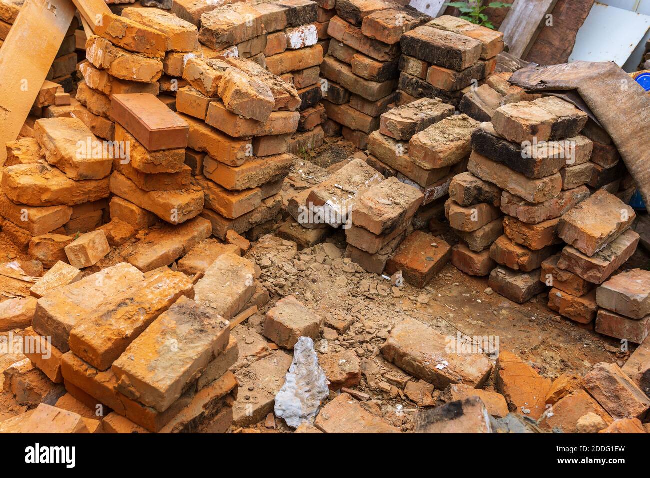 pile of red bricks at a construction site in the city. Repair ...