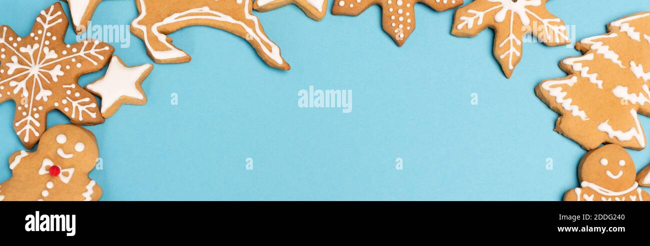 top view of winter gingerbread cookies on blue background, banner Stock ...