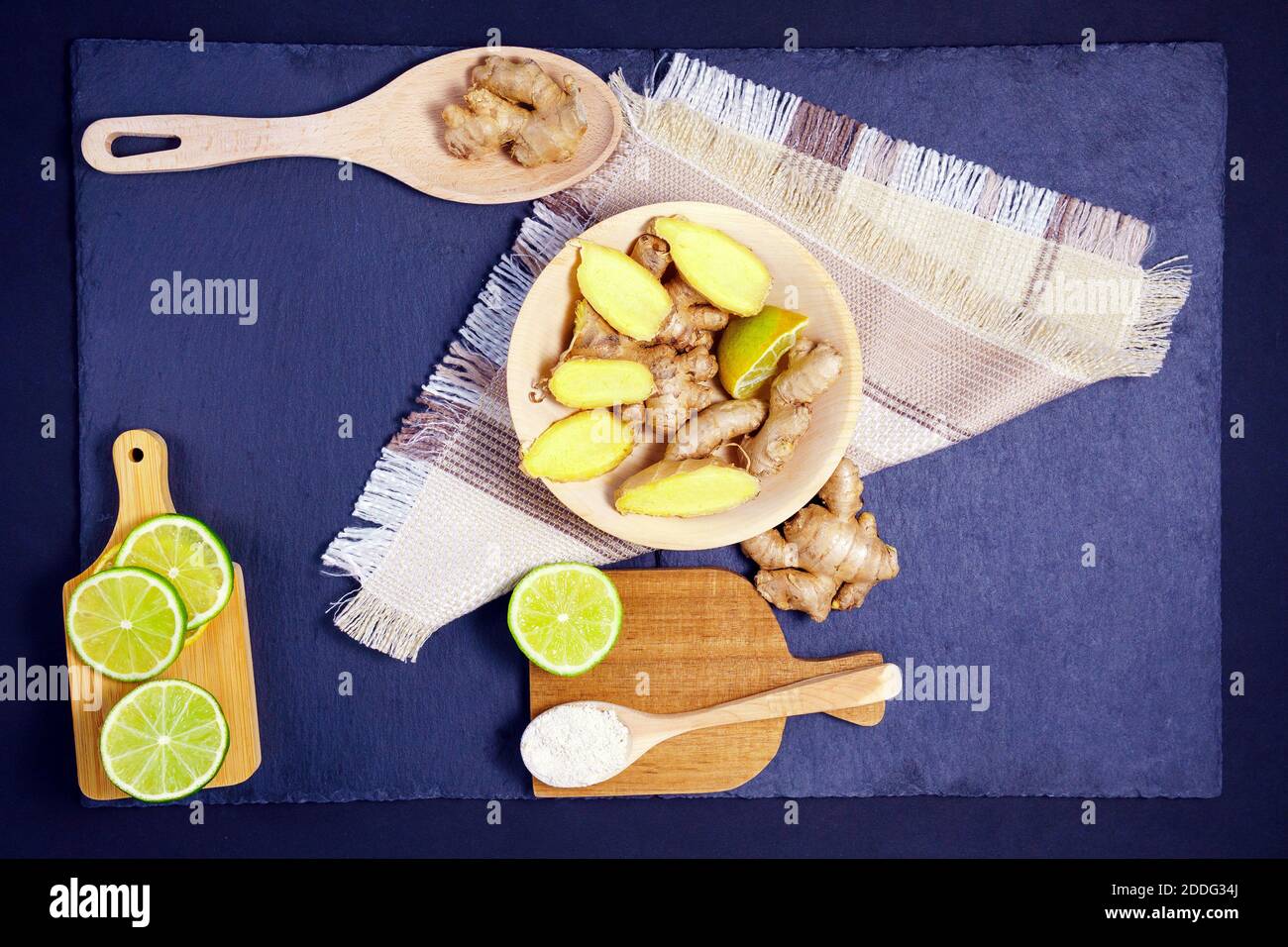 concept of healthy eating. fruits roots of ginger, slices lime, honey ...