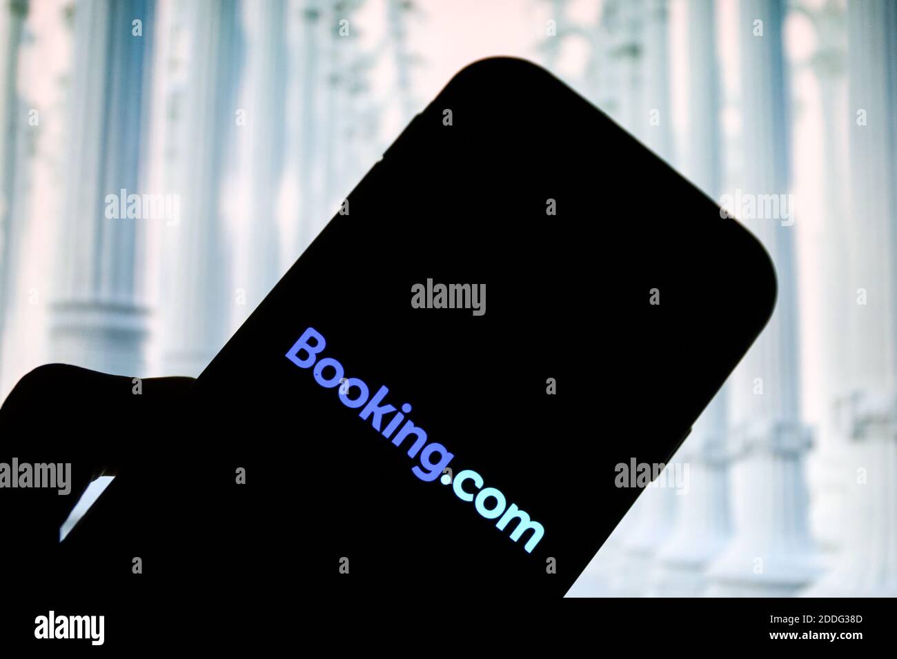In this photo illustration a Booking.com company logo seen displayed on ...