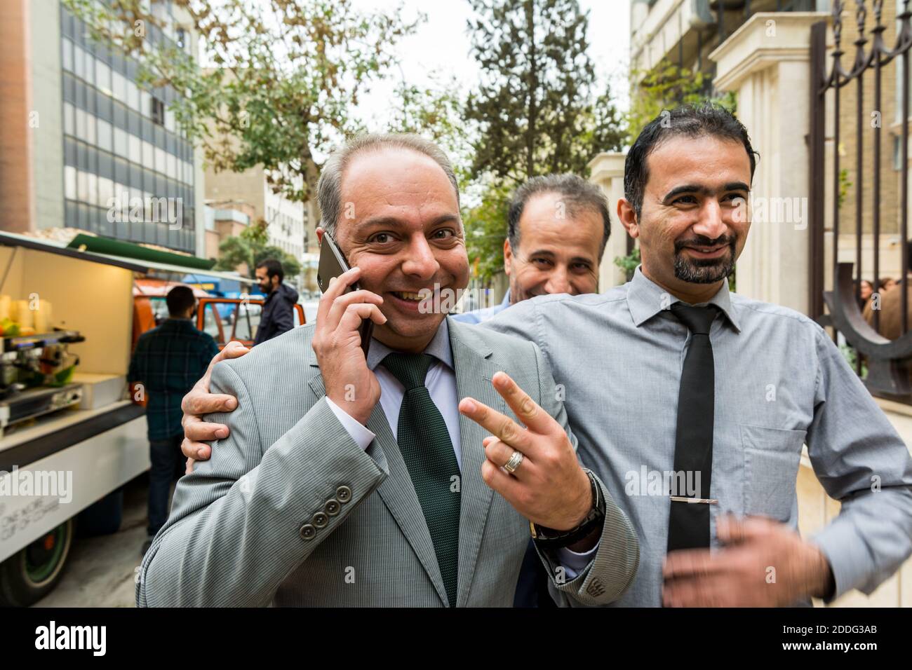 Iranian men talking a smart phone in Tehran, Iran Stock Photo - Alamy