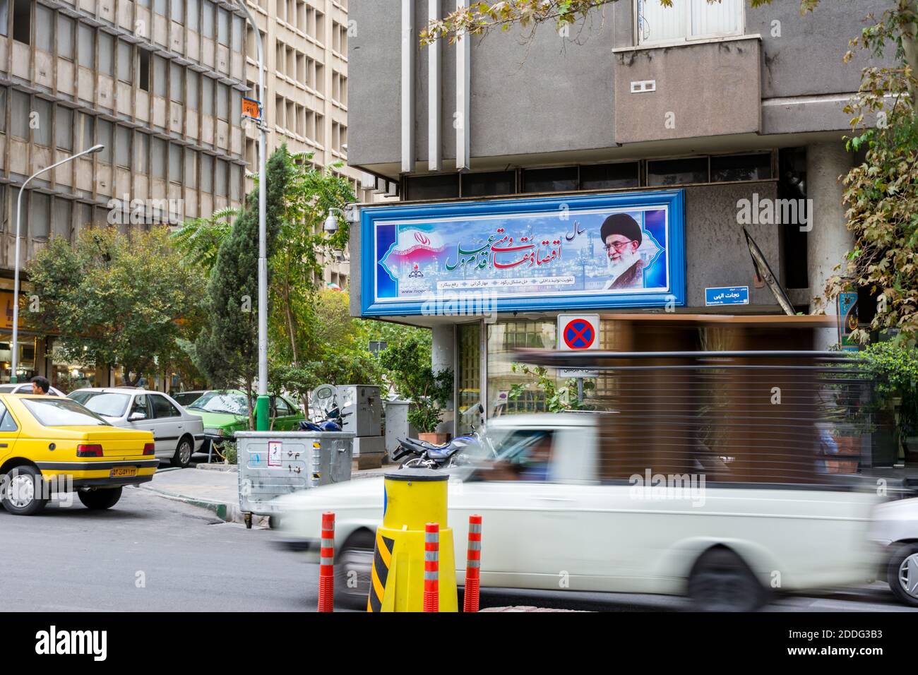 Street view in the downtown of Tehran with poster of Supreme Leader of ...
