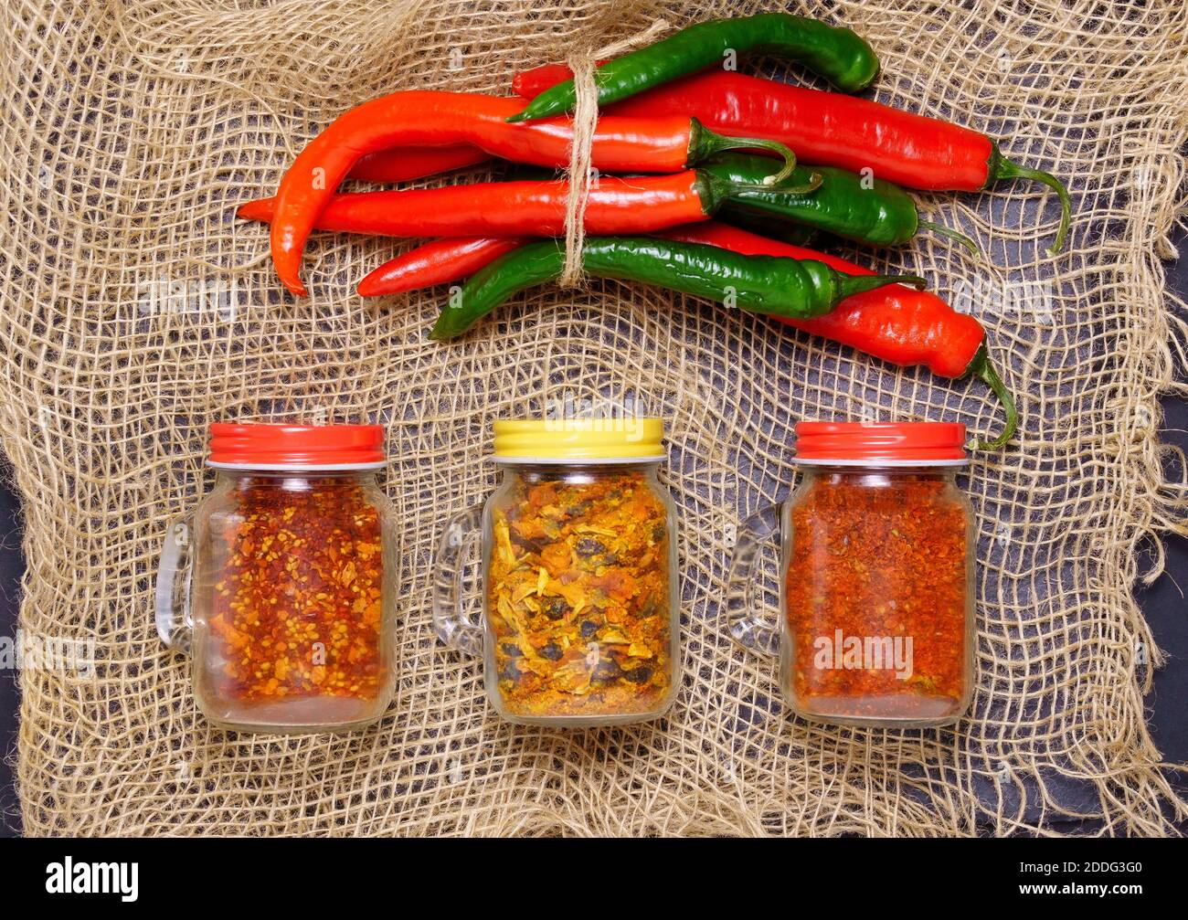 red and green hot chili pepper top view with spices. flat lay Stock ...
