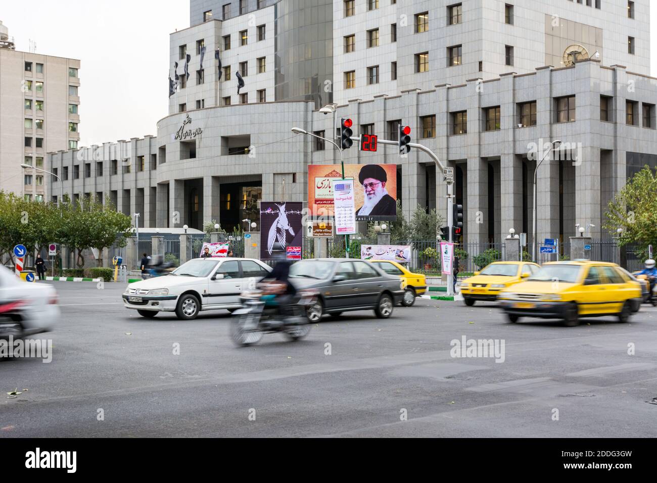 Street view in the downtown of Tehran with poster of Supreme Leader of ...