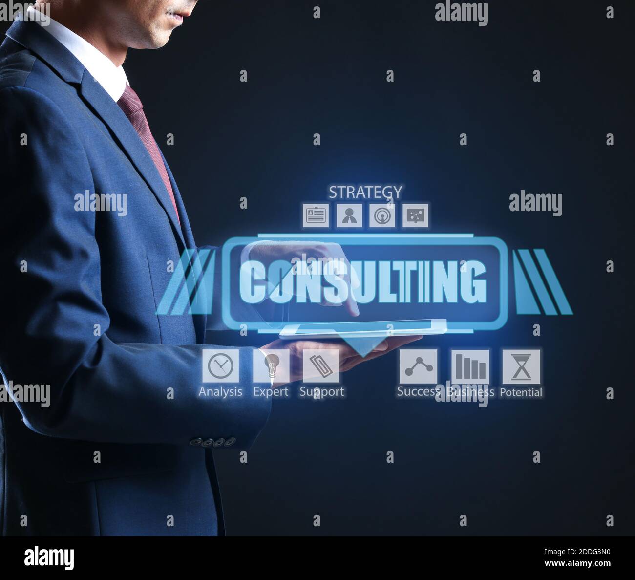 Business consultant with tablet computer using virtual screen on dark ...