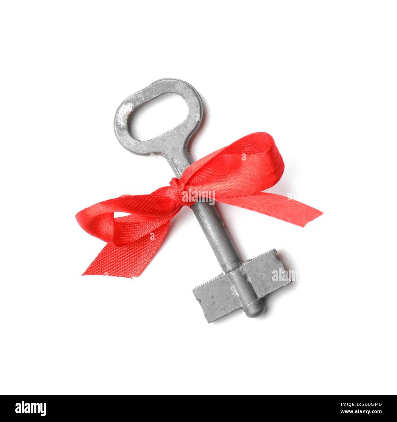 Key with bow on white background Stock Photo - Alamy