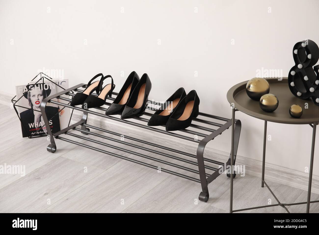Stylish interior of modern hall with shoe stand and table Stock Photo ...