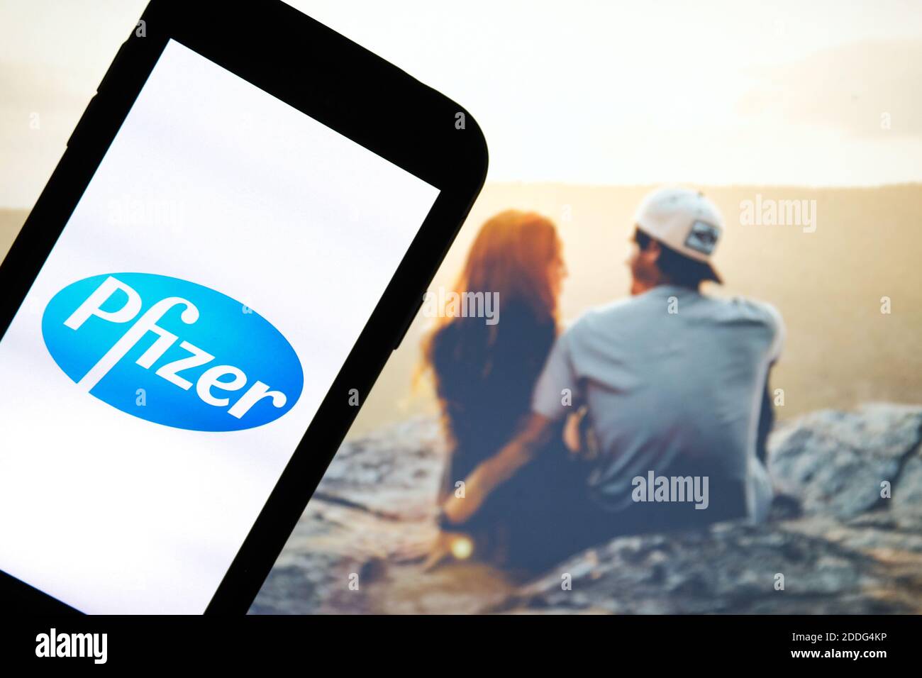 In this photo illustration a Pfizer pharmaceutical company logo seen ...