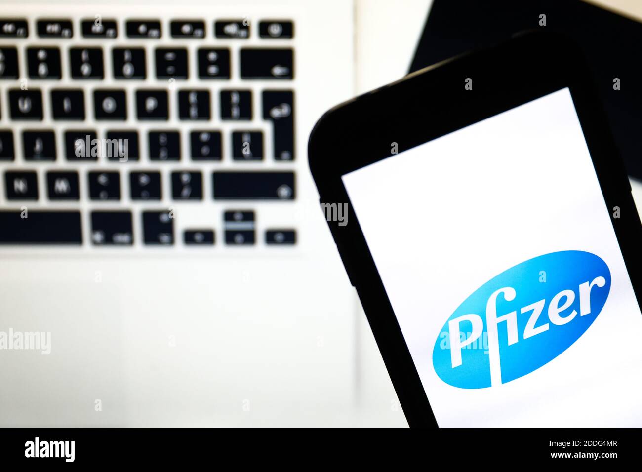 In this photo illustration a Pfizer pharmaceutical company logo seen ...