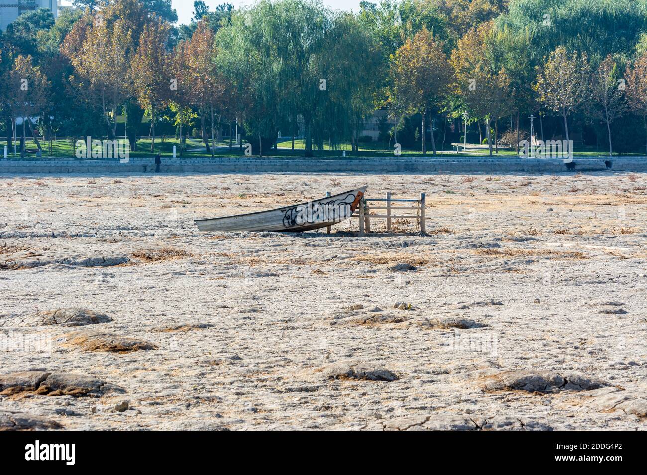 A wooden boat in the drought Zayandeh River, or Zayandeh-Rood or ...