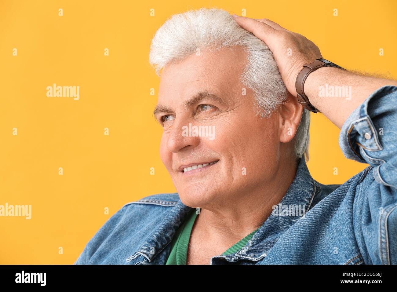 Stylish senior man on color background Stock Photo - Alamy