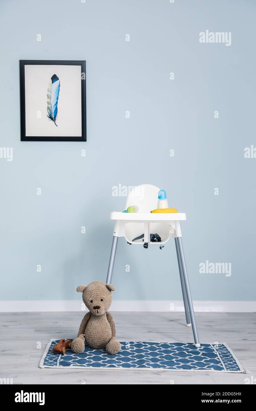 Modern interior with baby highchair Stock Photo - Alamy