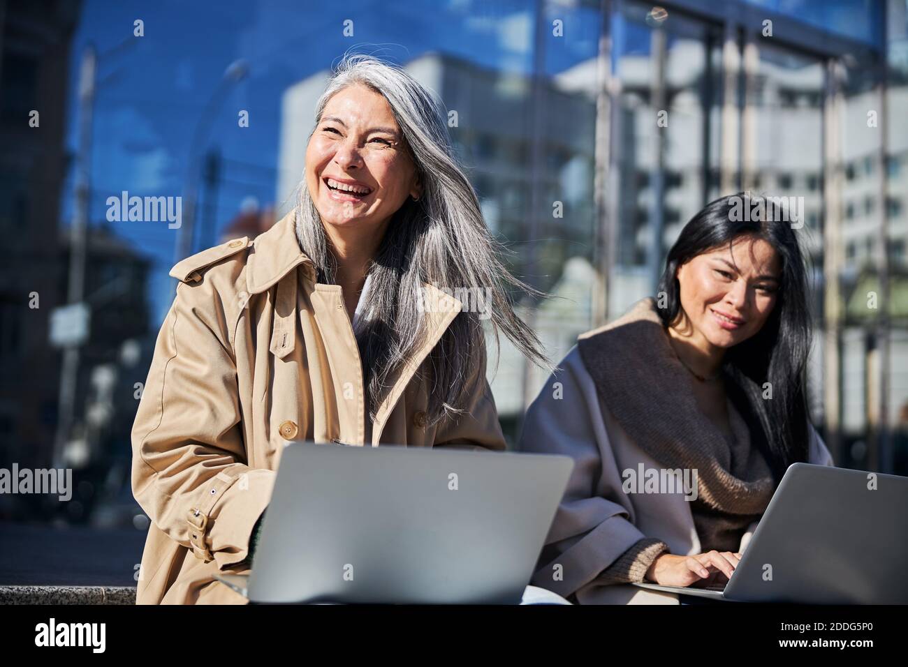 Cheerful female friends using hi-res stock photography and images - Alamy