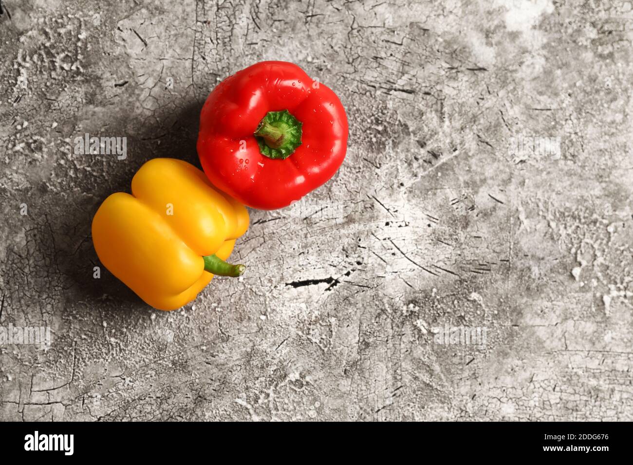 Fresh bell peppers on textured background Stock Photo - Alamy