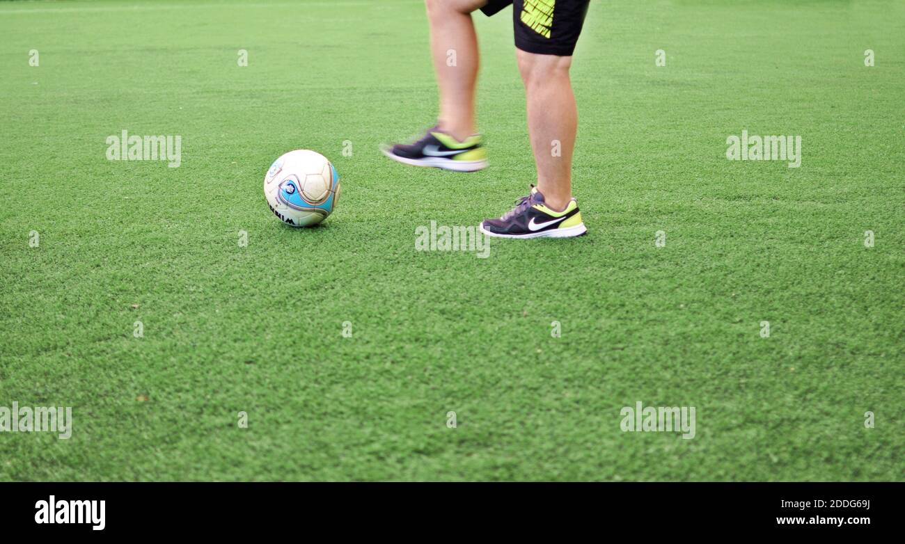 Kicking a ball hi-res stock photography and images - Alamy