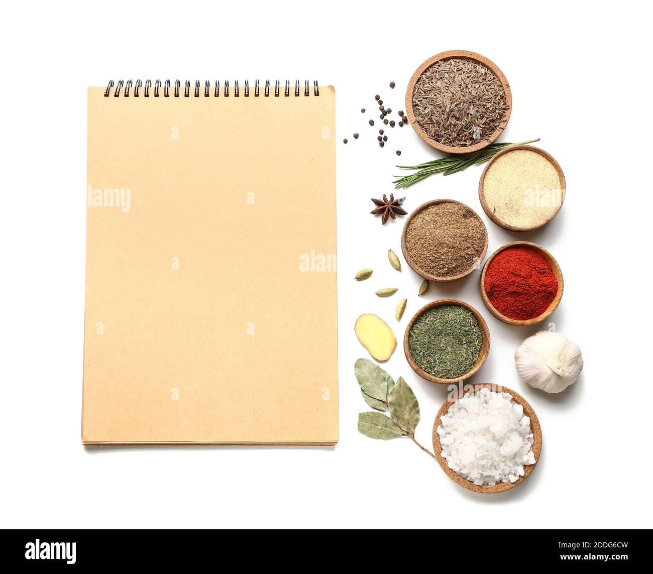 Cook book with various spices on white background Stock Photo - Alamy