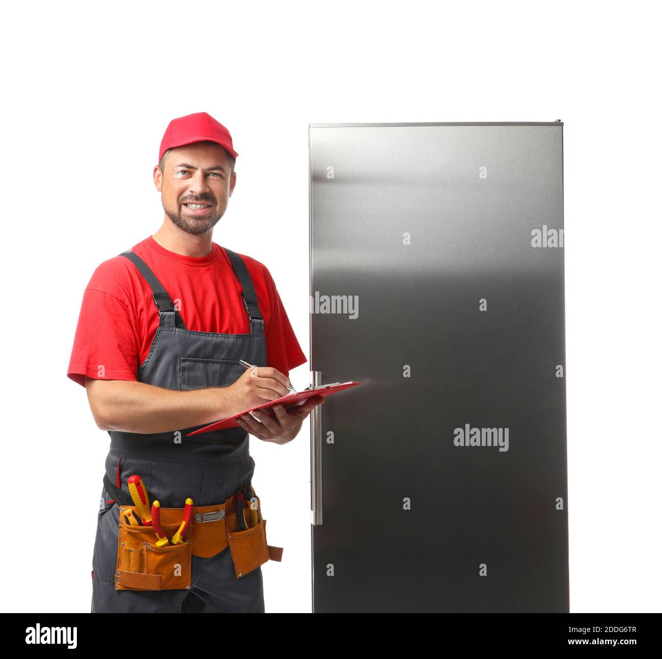 Worker of repair service near fridge on white background Stock Photo ...