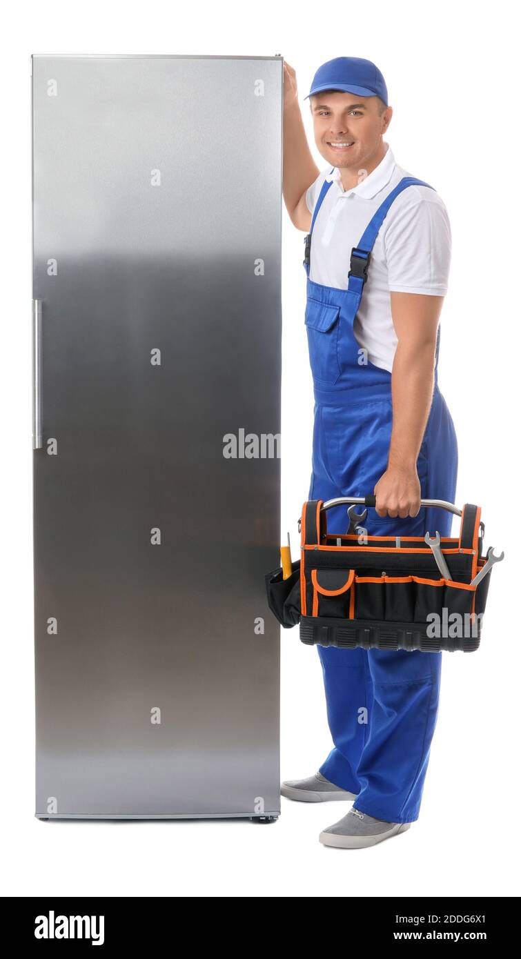 Worker of repair service near fridge on white background Stock Photo ...