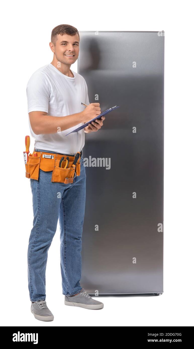 Worker of repair service near fridge on white background Stock Photo ...