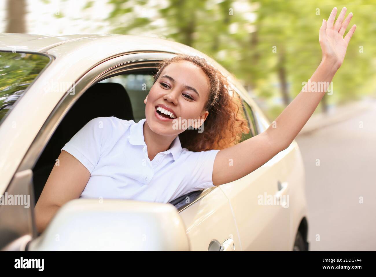 Happy African-American female driver in car Stock Photo - Alamy