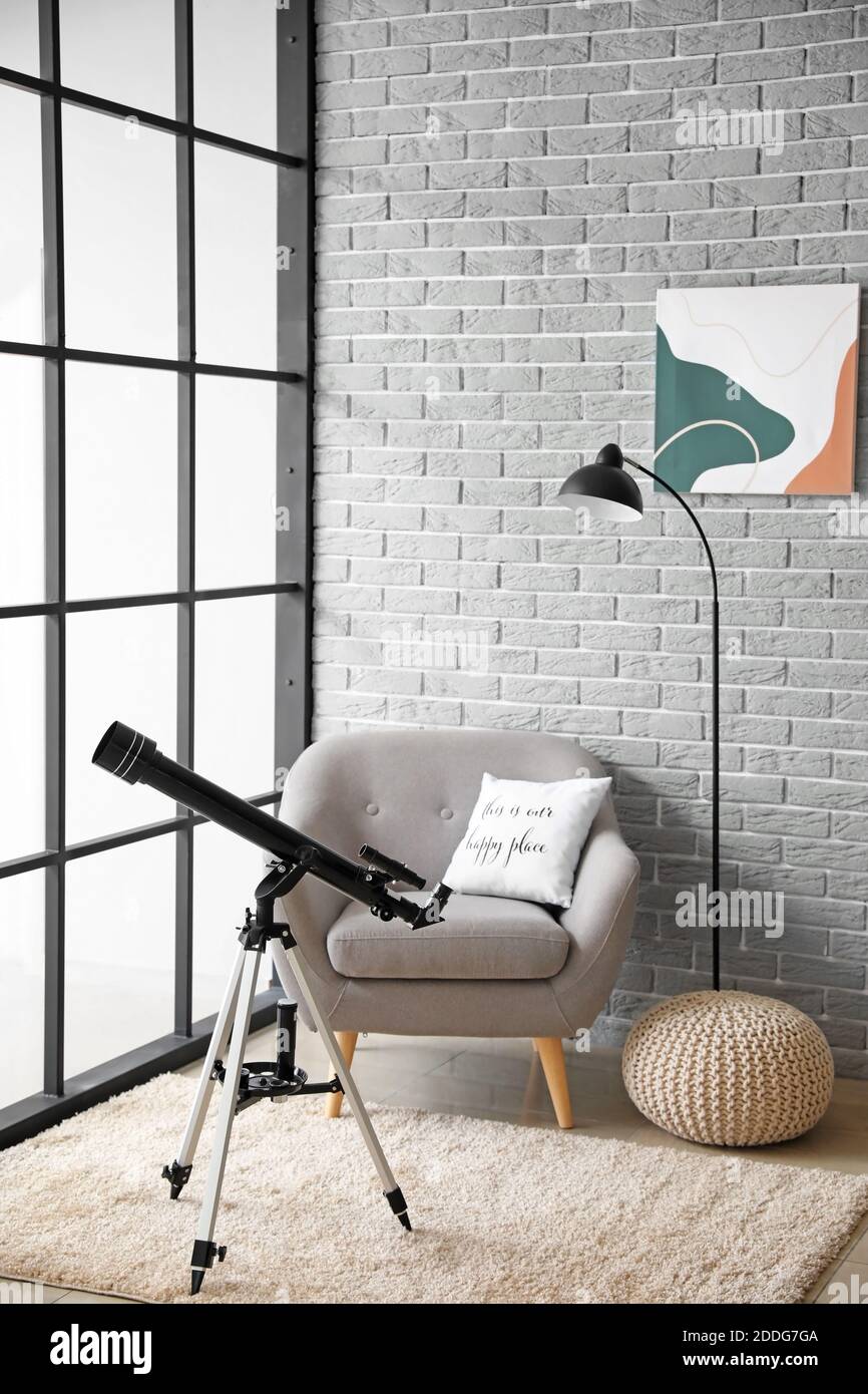 Interior of modern room with telescope Stock Photo - Alamy