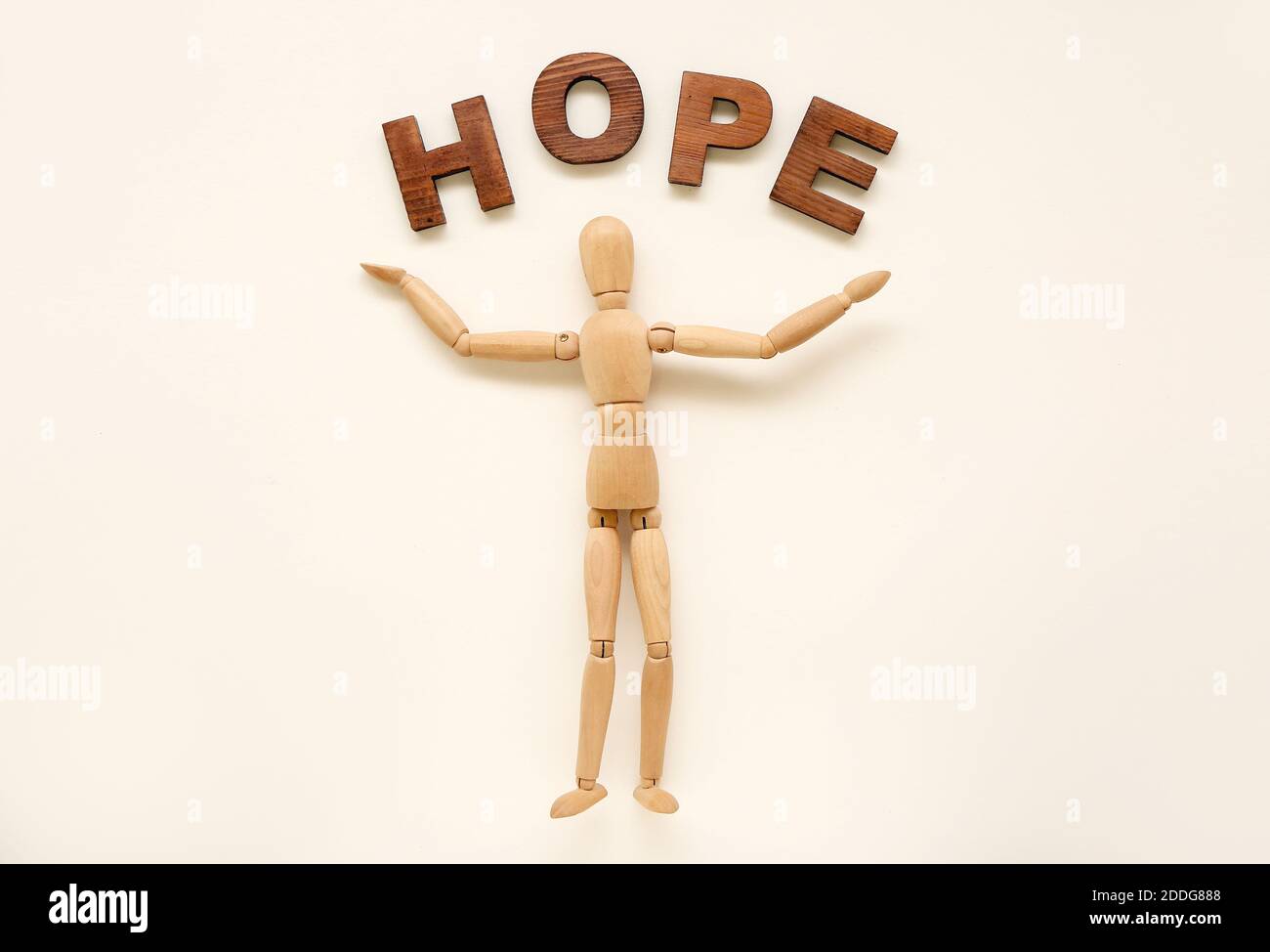 Wooden mannequin with word HOPE on white background Stock Photo - Alamy