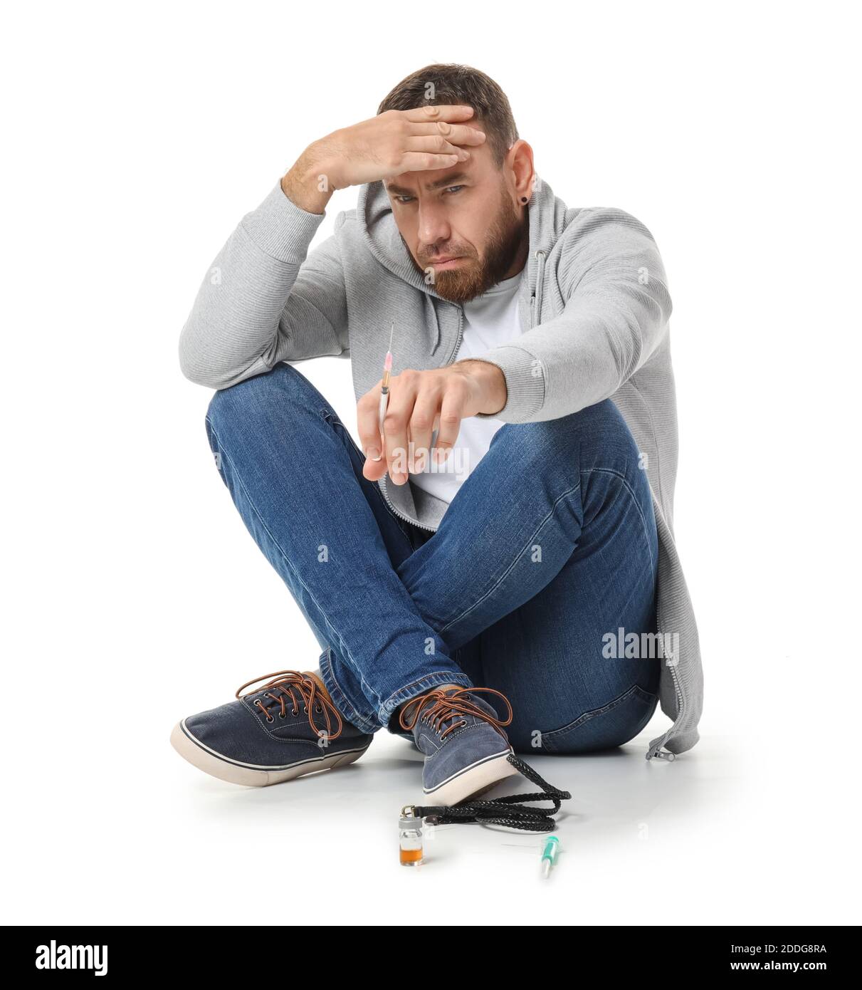 Male junkie with drugs on white background. Concept of addiction Stock ...