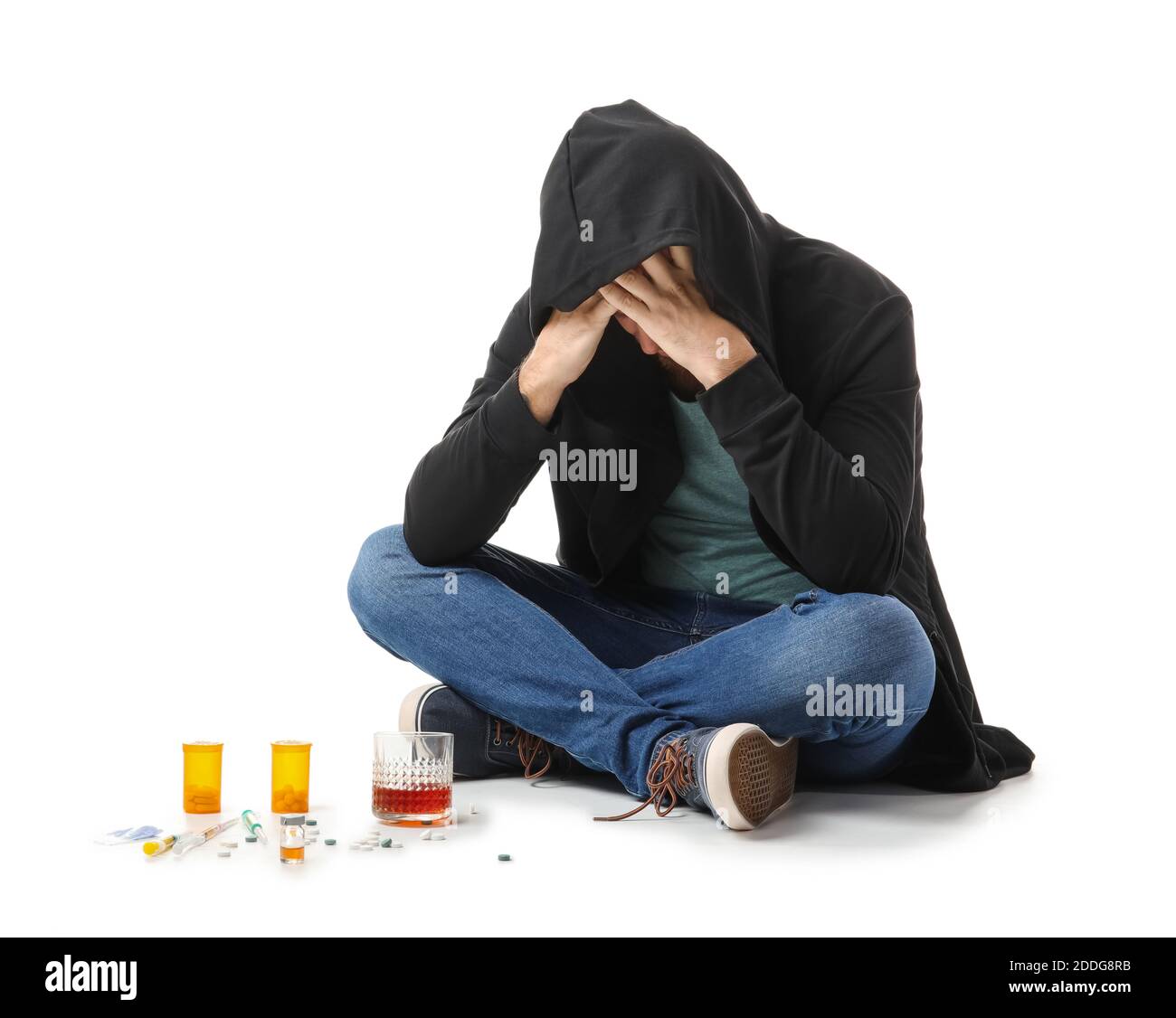 Male junkie with drugs and alcohol on white background. Concept of ...