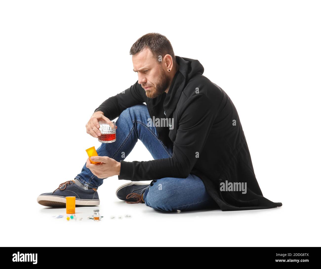 Male junkie with drugs and alcohol on white background. Concept of ...