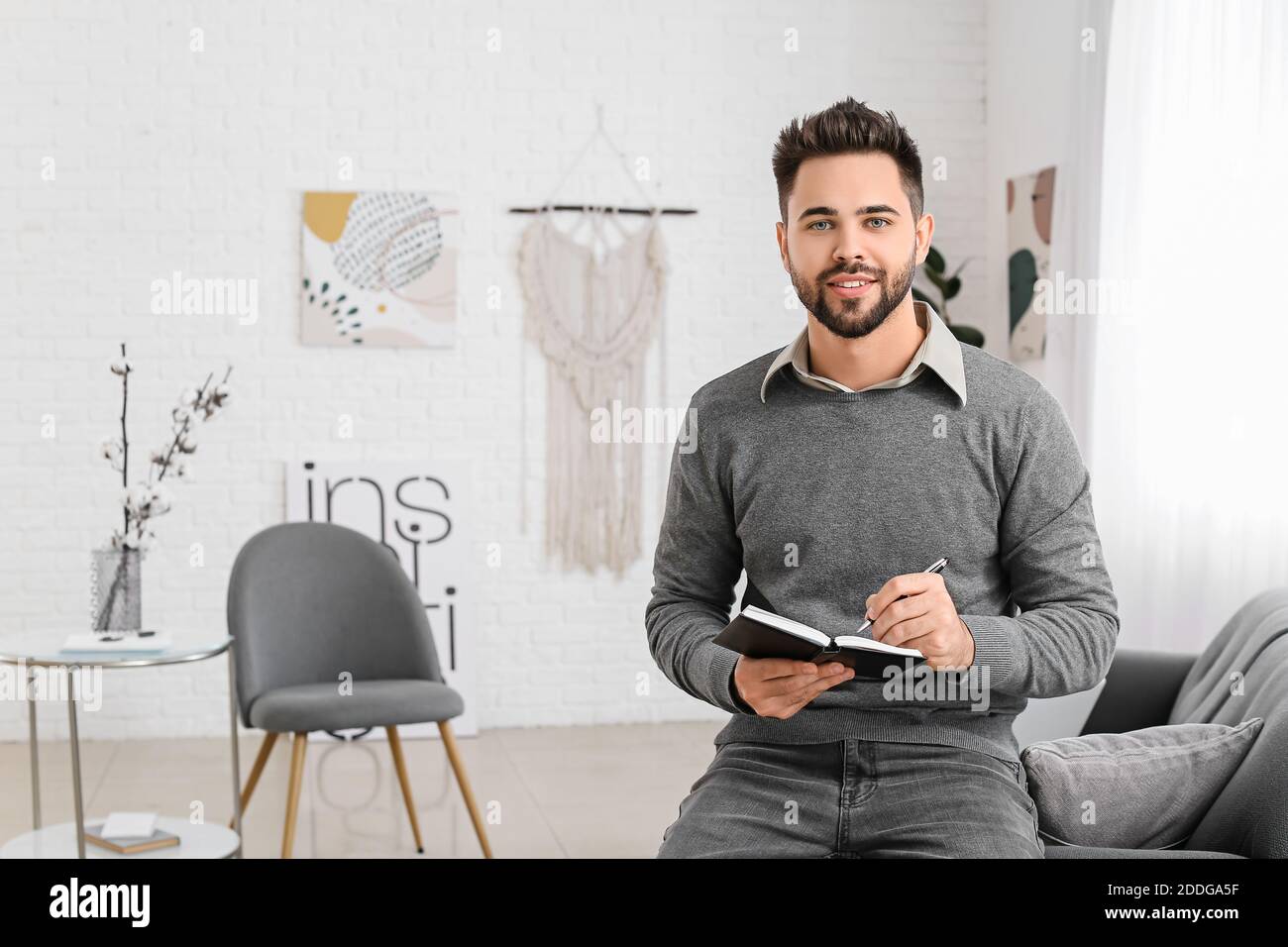 Portrait of young male psychologist in office Stock Photo - Alamy