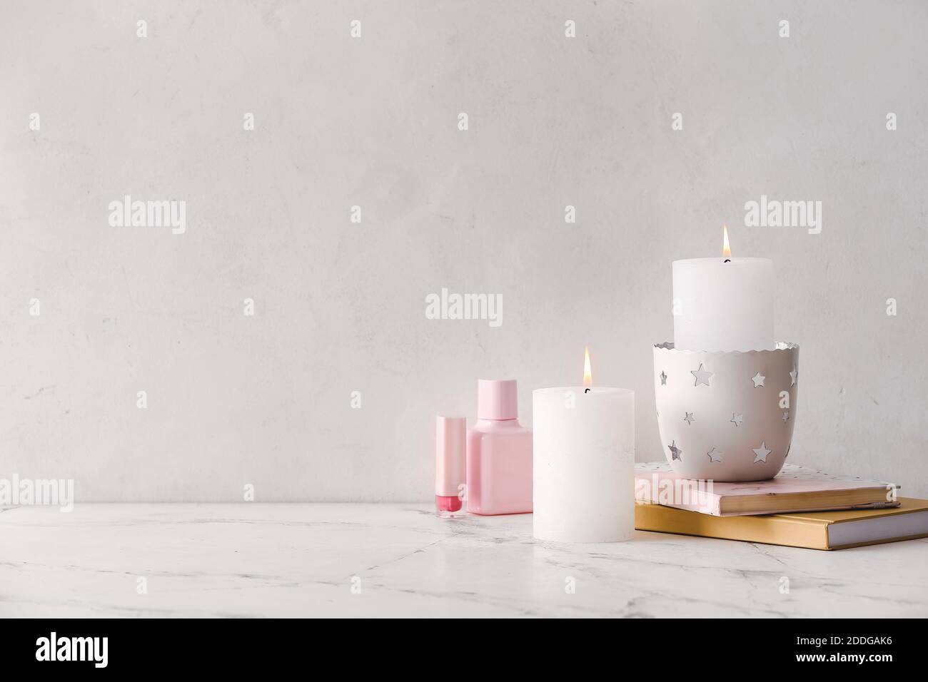 Beautiful aroma candles on dressing table in room Stock Photo - Alamy