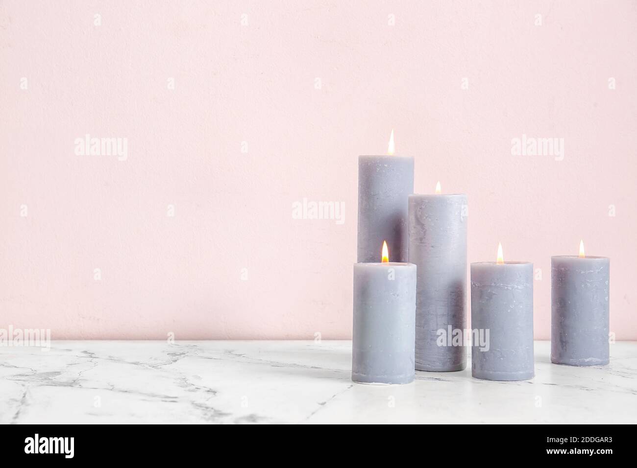 Beautiful aroma candles on table Stock Photo - Alamy