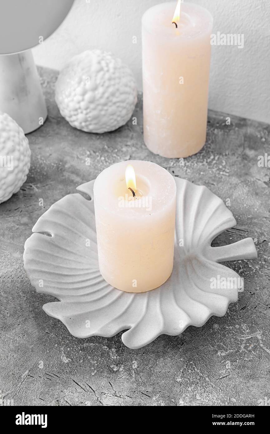 Beautiful aroma candles on grey background Stock Photo - Alamy