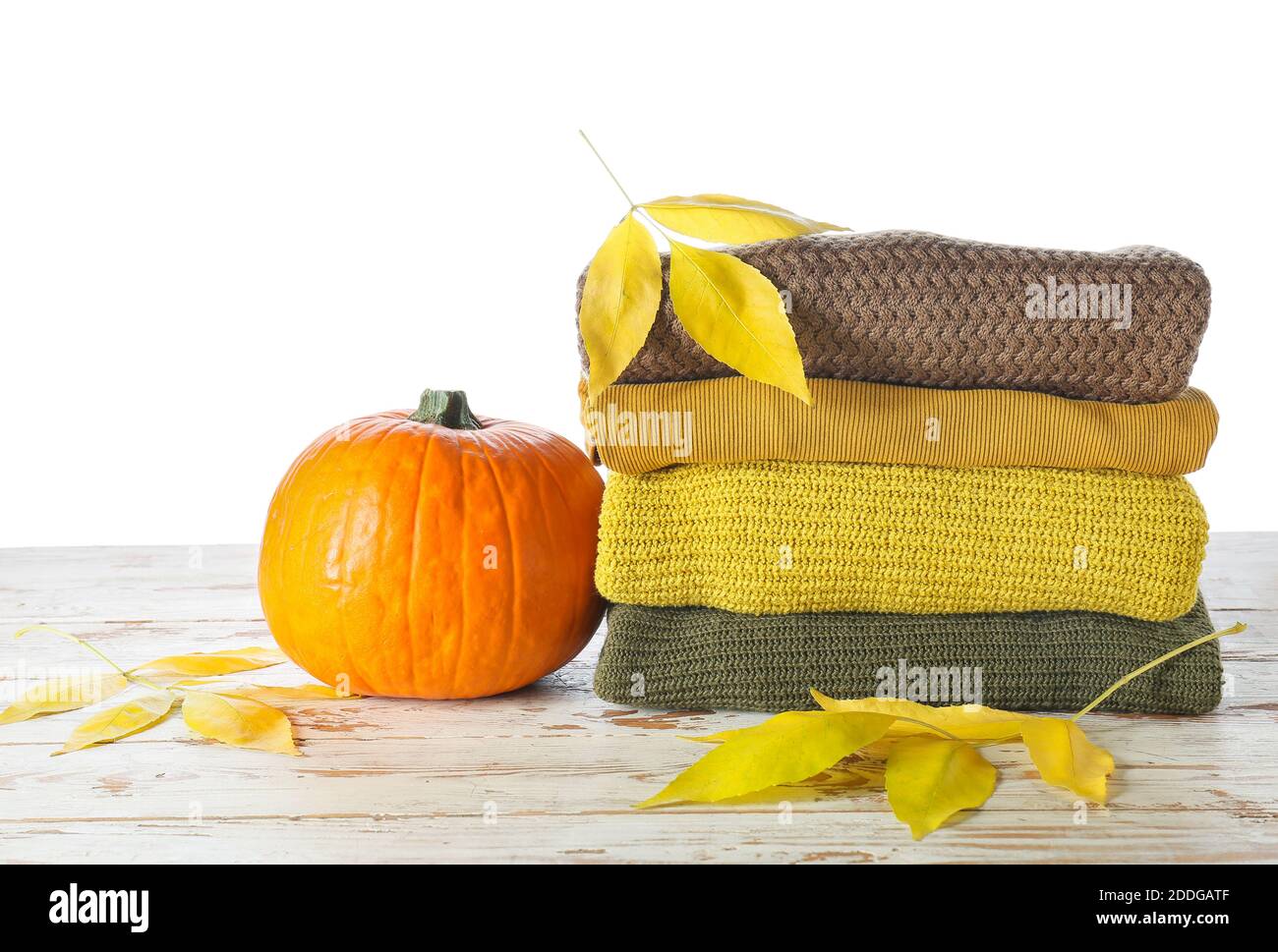 Stylish autumn clothes on table against white background Stock Photo ...