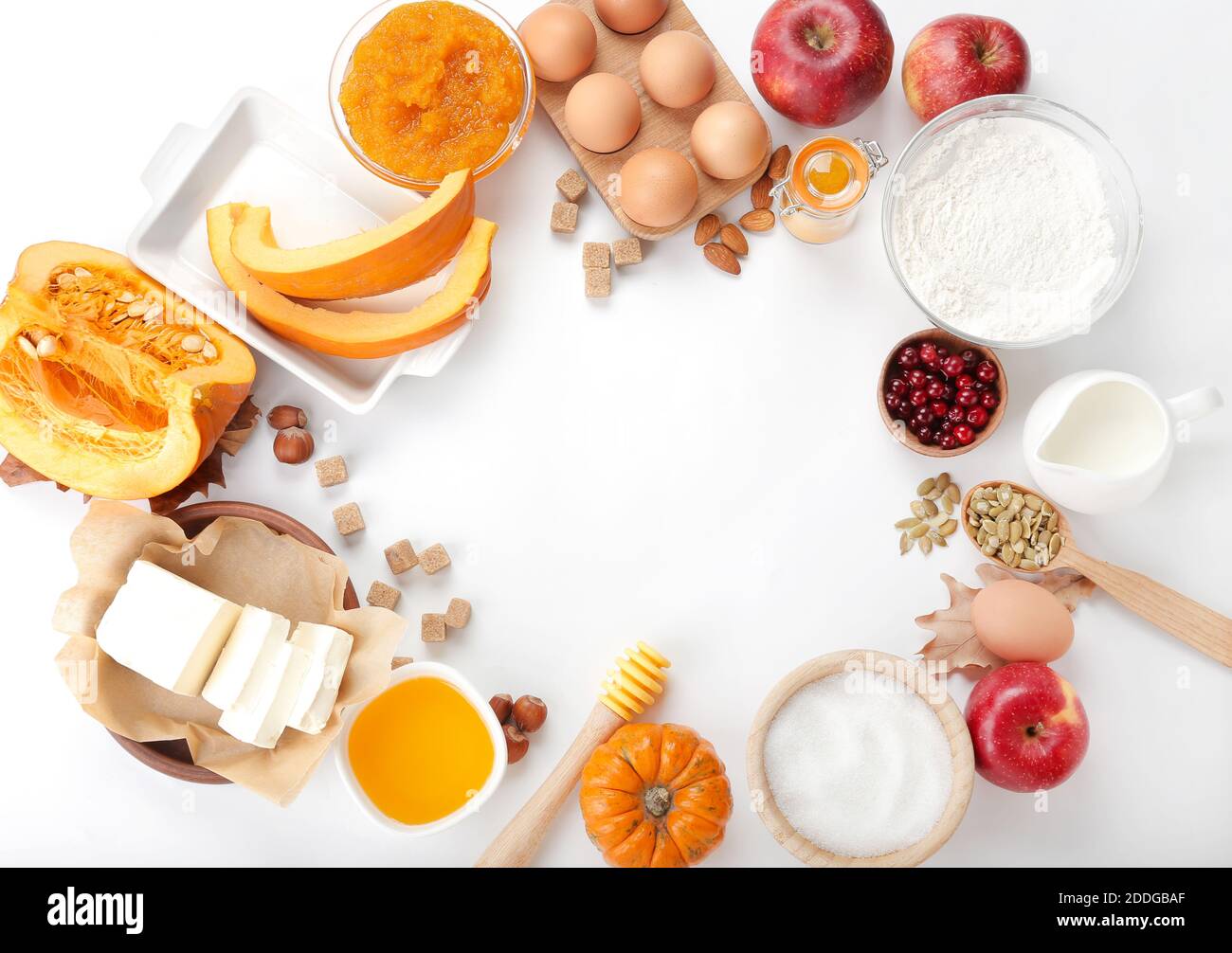 Frame made of ingredients for preparing pumpkin pie on white background ...