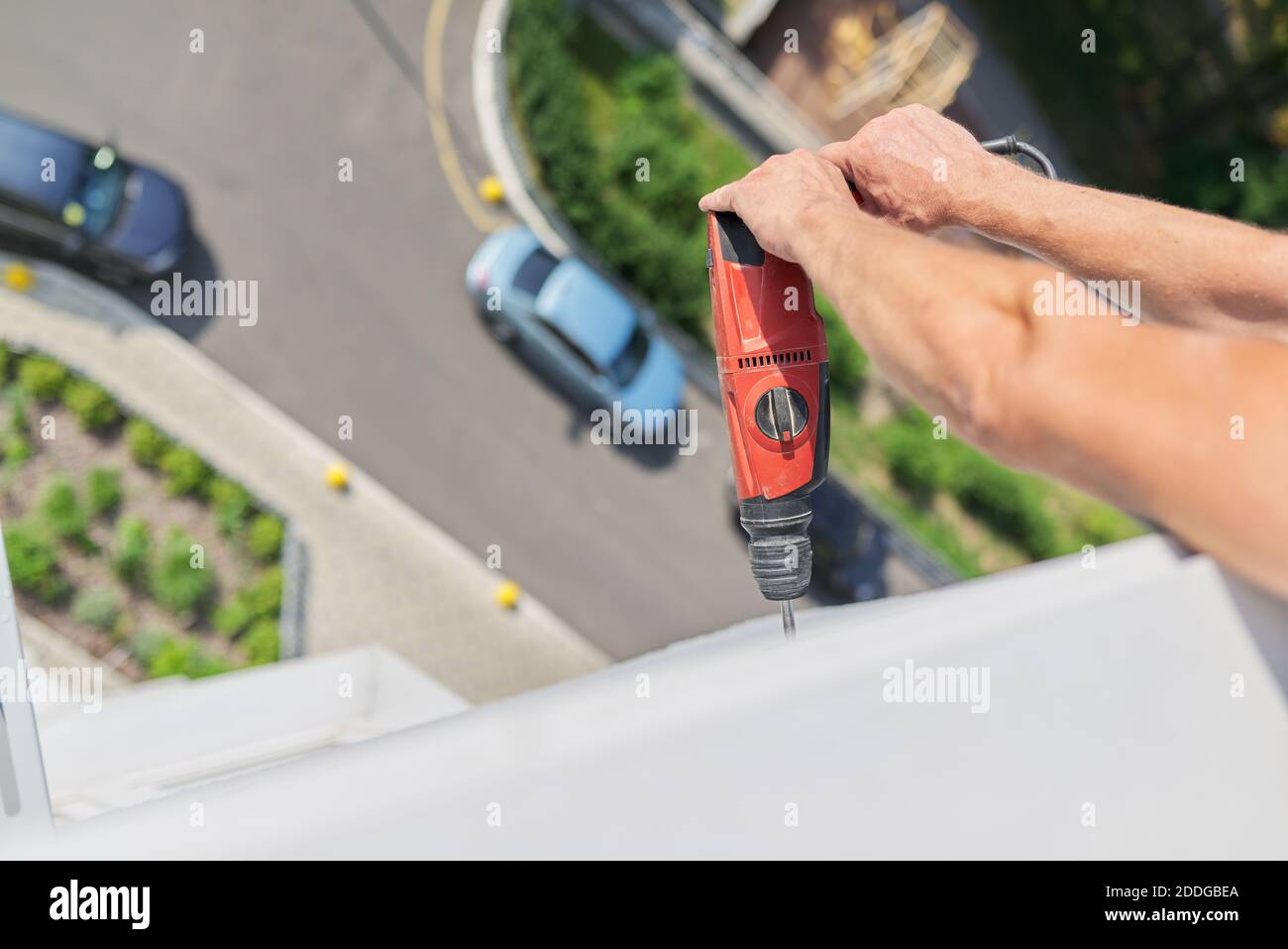 Installing the outdoor unit of the air conditioner, using drill fixing ...