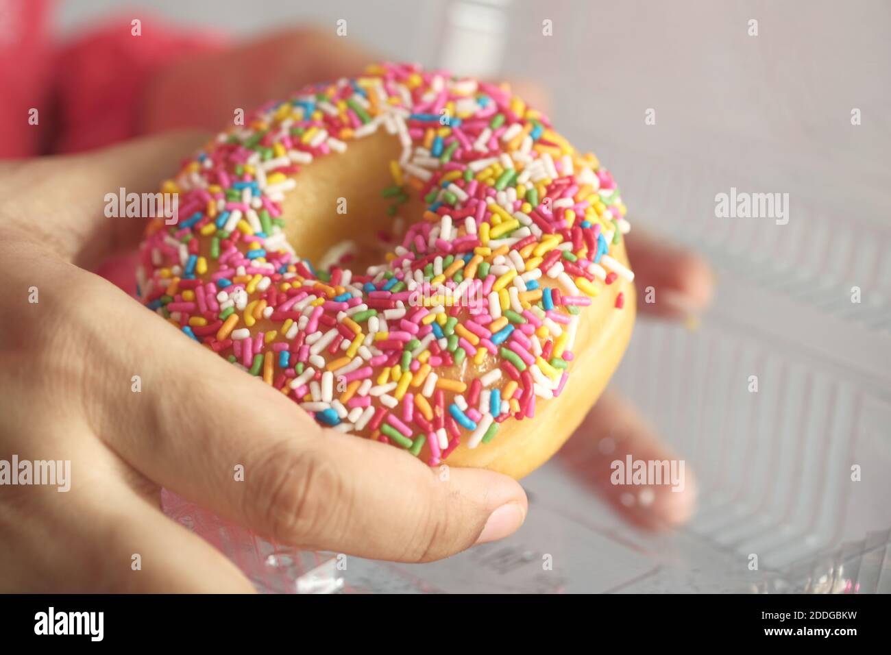 Holding up donuts hi-res stock photography and images - Alamy