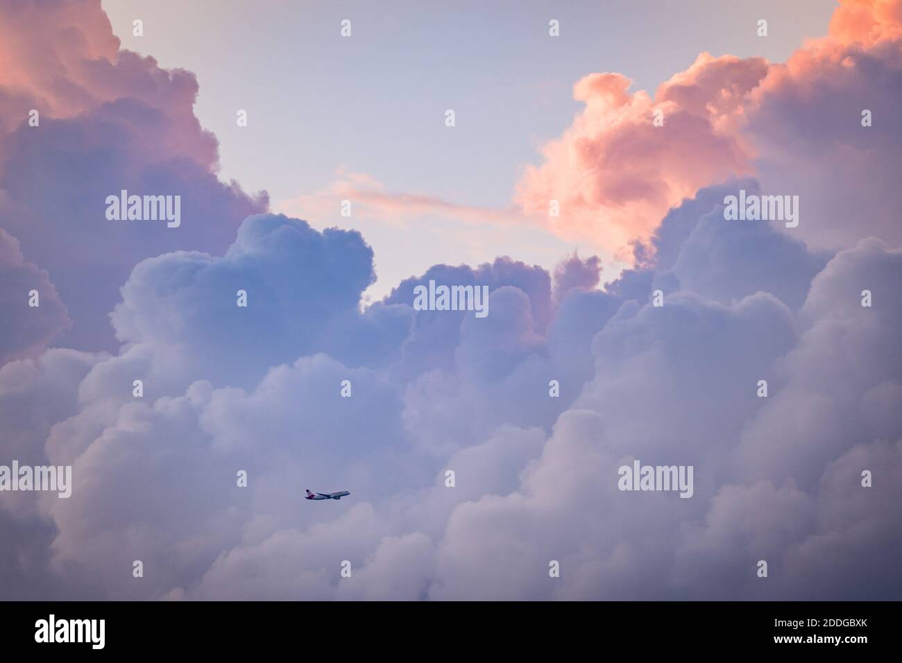 Airplane flying in dark clouds hi-res stock photography and images - Alamy