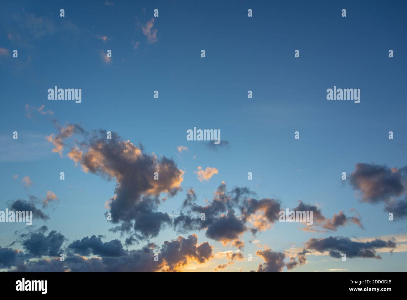 Colorful sky with clouds at sunset, nature background Stock Photo - Alamy
