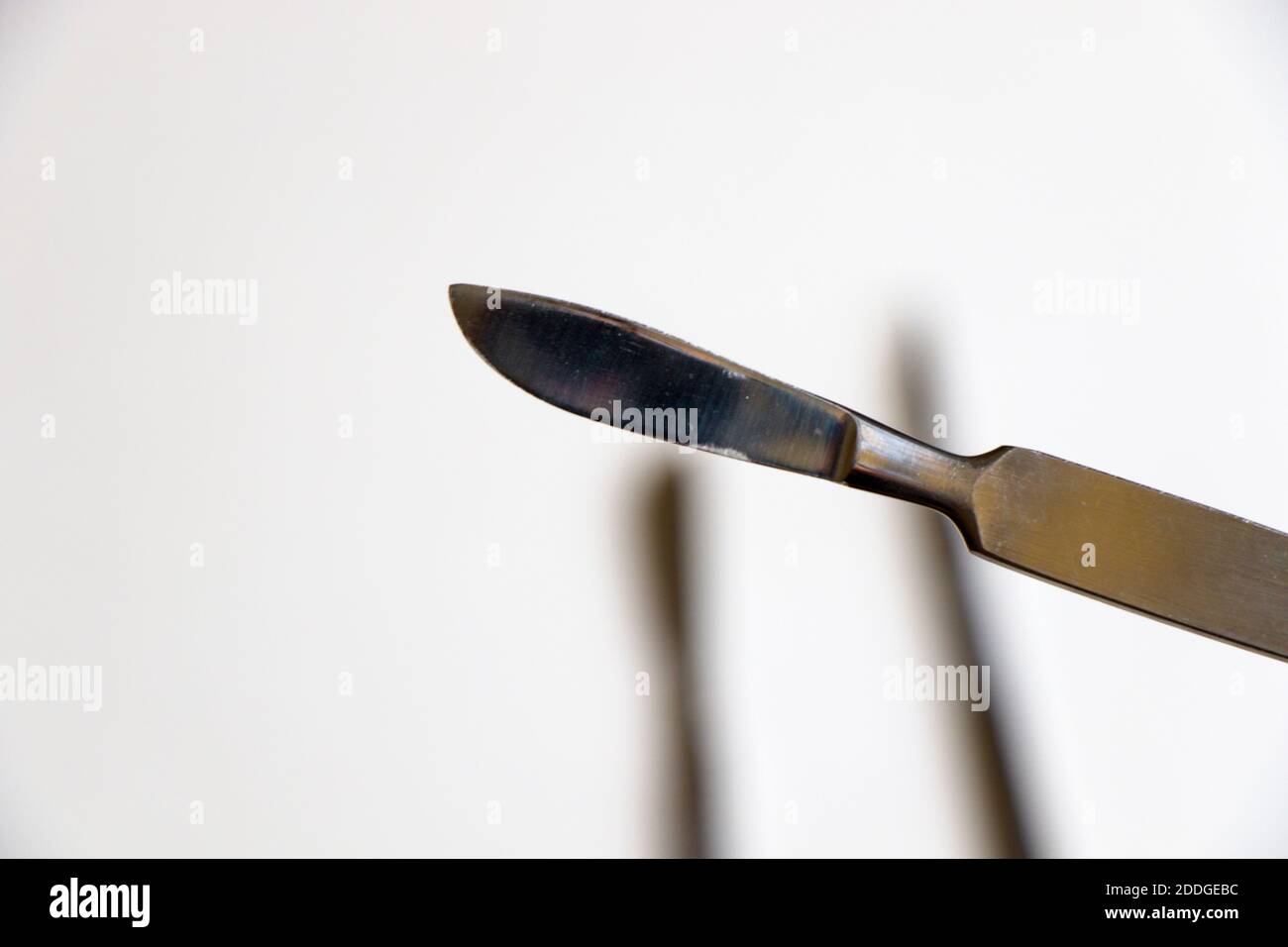 Surgery blade on the sterile table, scalpel close-up, operation ...